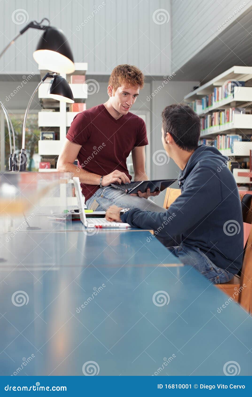 Two Guys Studying in Library Stock Image - Image of college, holding ...