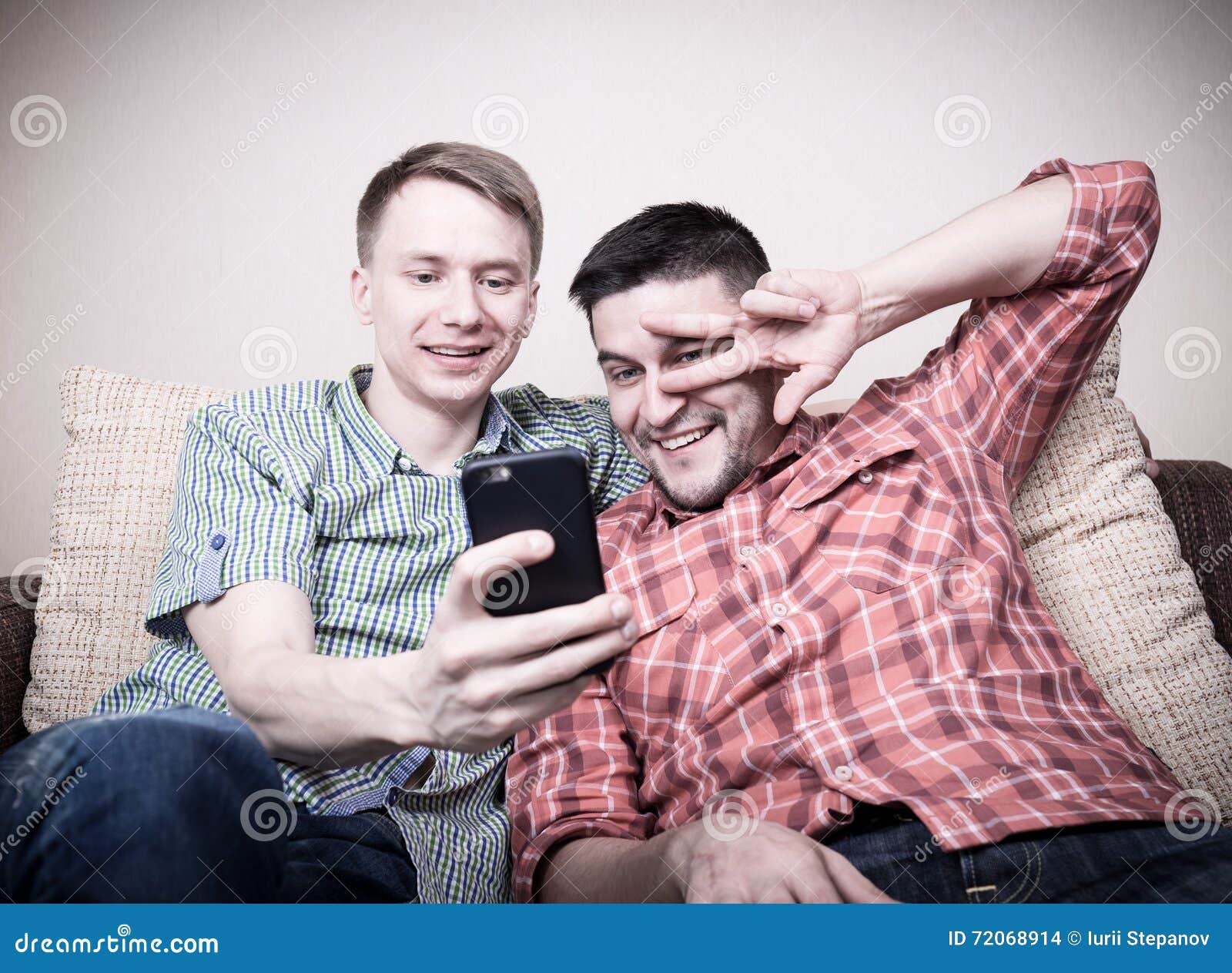 Two guys taking selfie stock photo. Image of couch, friends - 72068914
