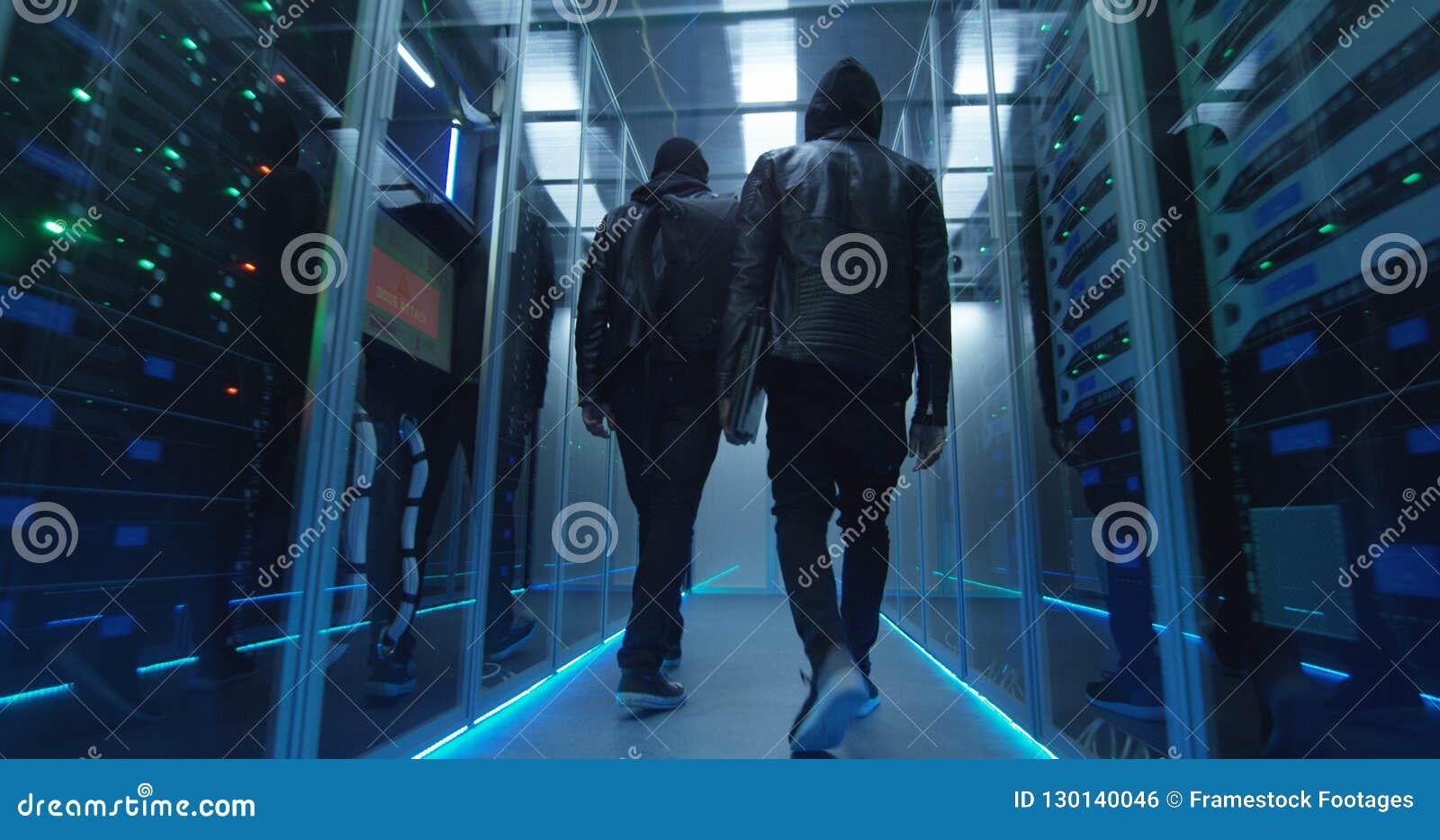 Two Hackers Walking through Rows of Servers Stock Photo - Image of ...