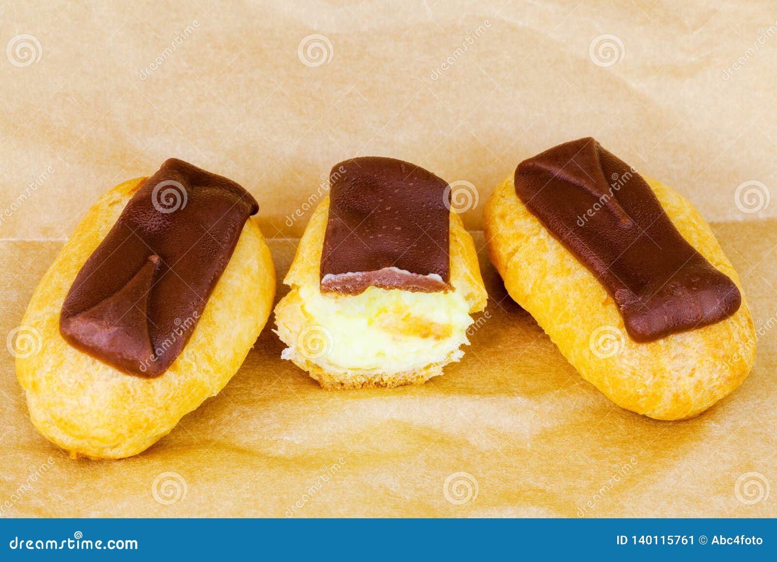Two and Half Eclairs on Paper Stock Image - Image of meal, confection ...