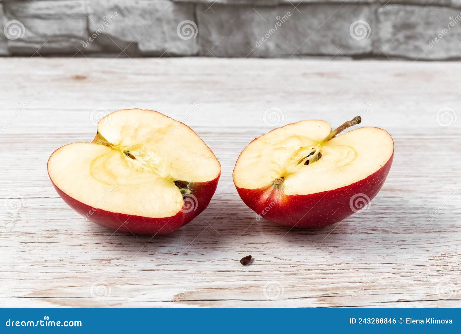 Two Halves of an Apple on the Table. Cut Apple in Half Stock Photo ...