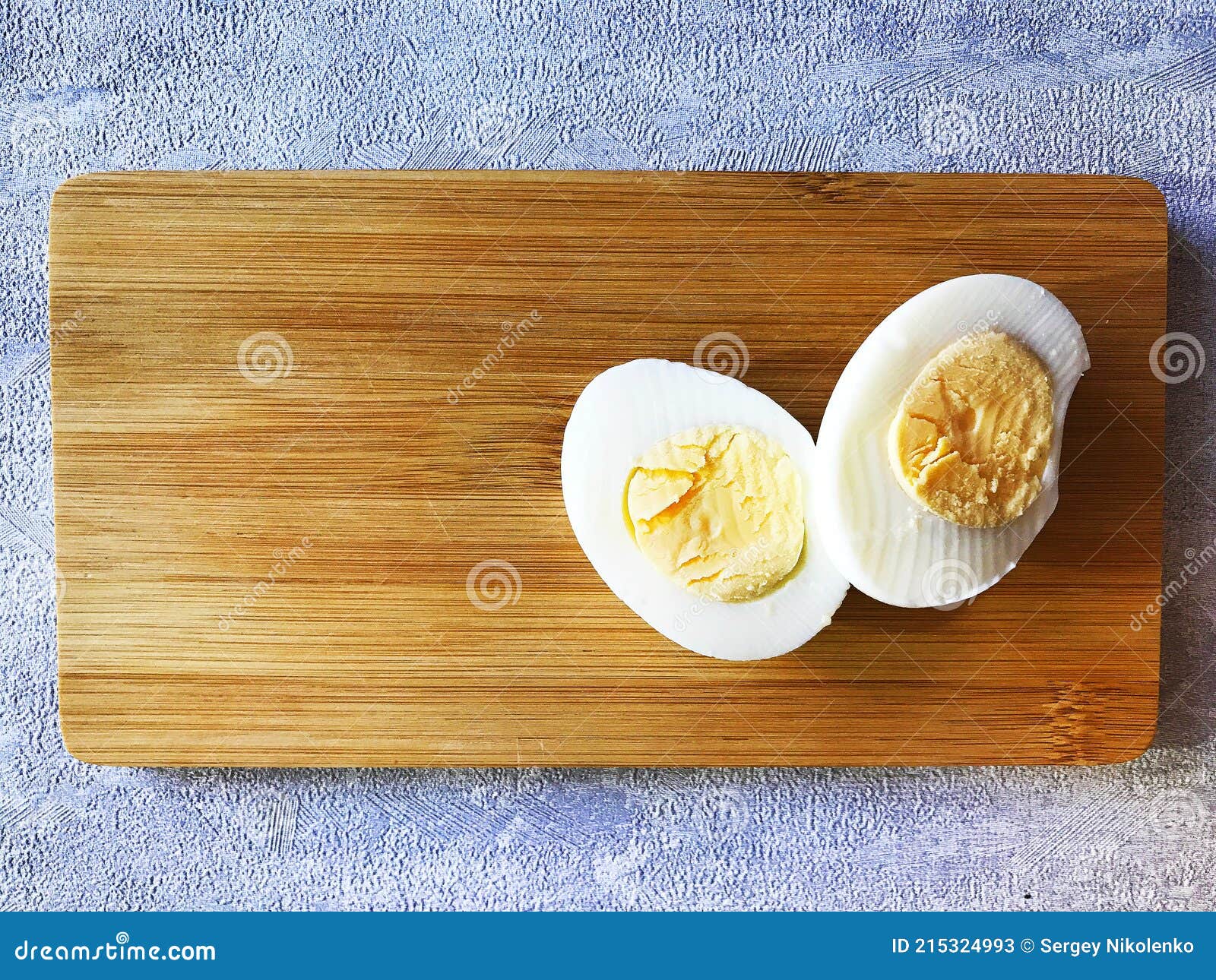 Two Halves of a Boiled Egg on a Board Stock Image - Image of organic ...