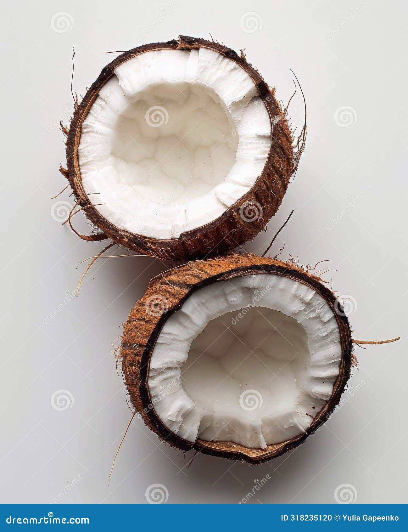 Two Halves of a Coconut on White Surface Stock Photo - Image of ...