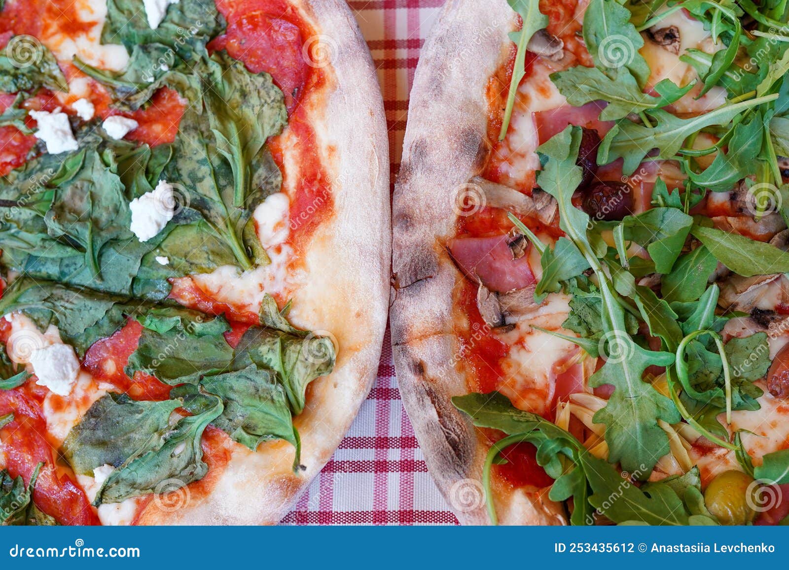 Two Halves of Different Pizzas on the Table in the Cafe Stock Photo ...
