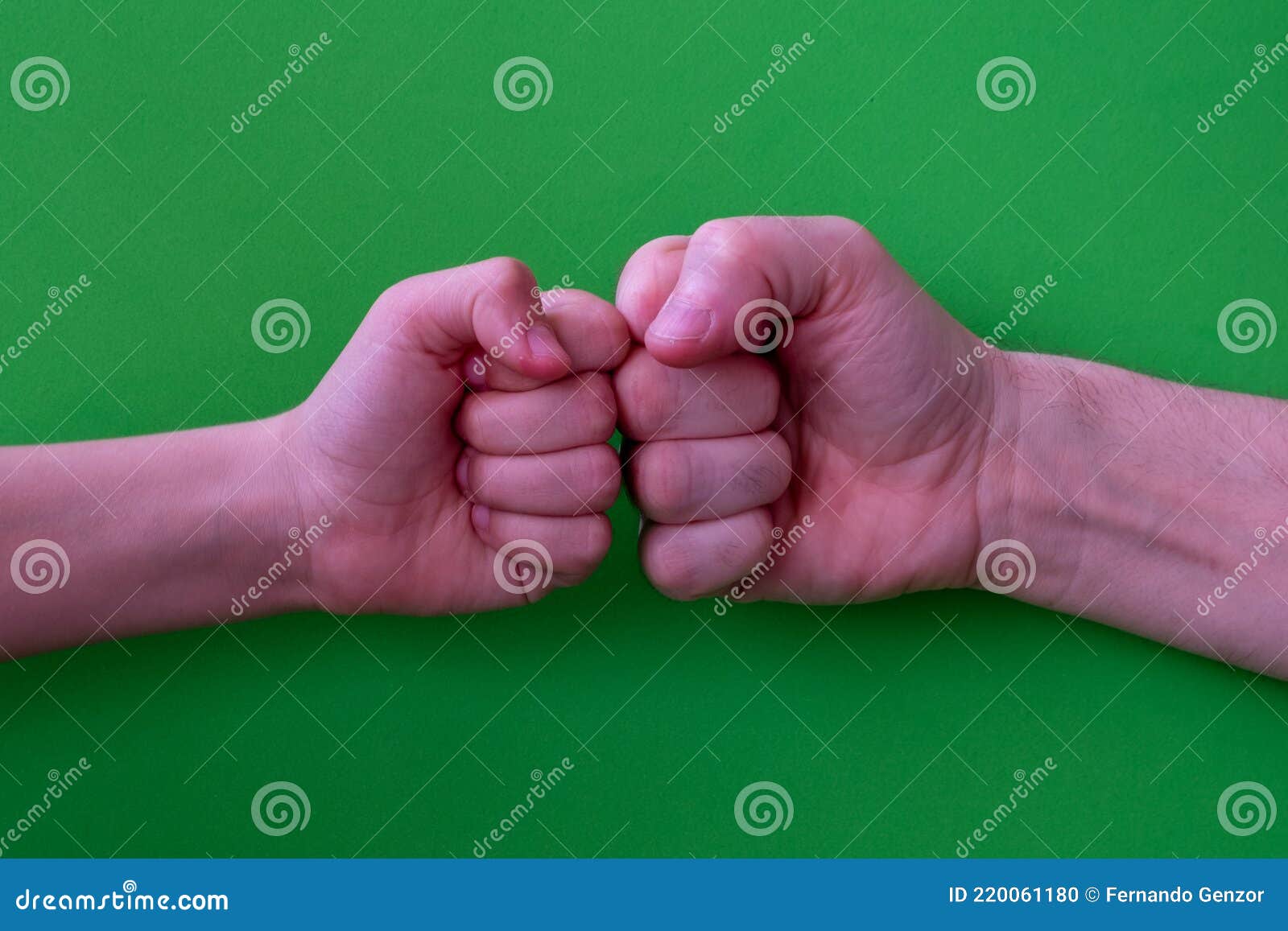Two Hands Bumping Fists on a Green Background Stock Photo - Image of ...