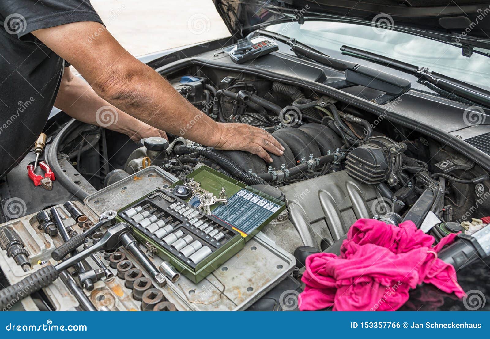 Two Hands Carry Out Repairs in the Engine Compartment Stock Photo ...