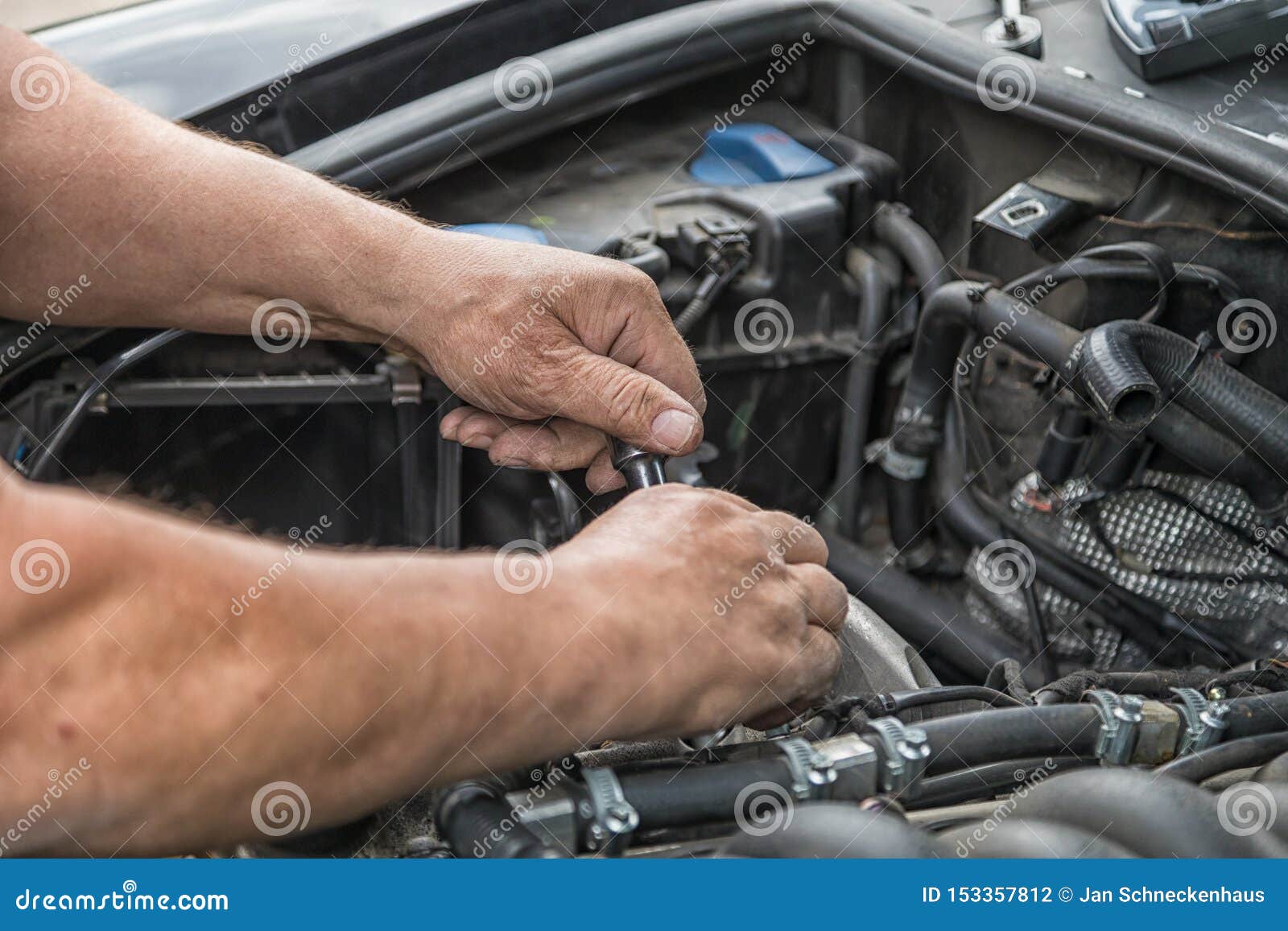 Two Hands Carry Out Repairs in the Engine Compartment Stock Photo ...