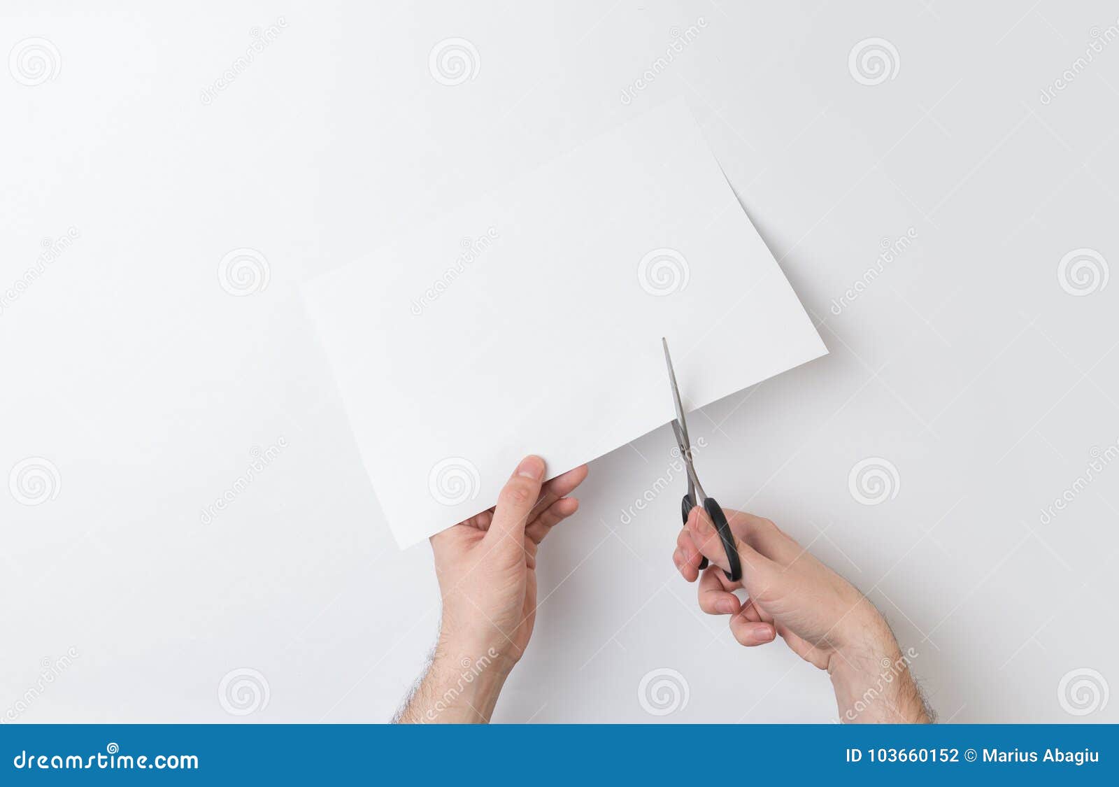 Two hands cutting paper stock photo. Image of hair, material - 103660152