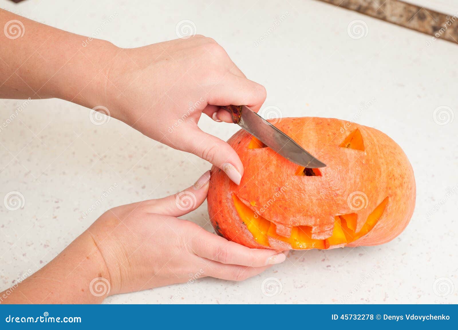 Two hands cutting pumpkin stock photo. Image of cutting - 45732278