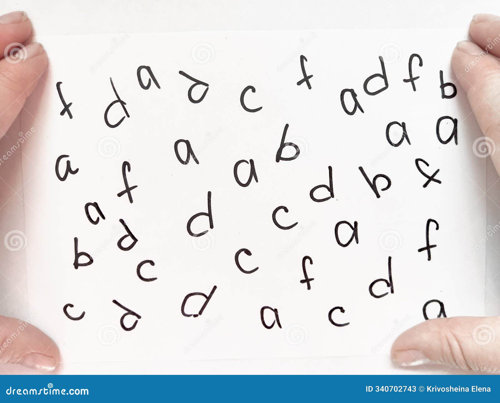 Two Hands Display a Sheet Covered with Black Handwritten Letters ...