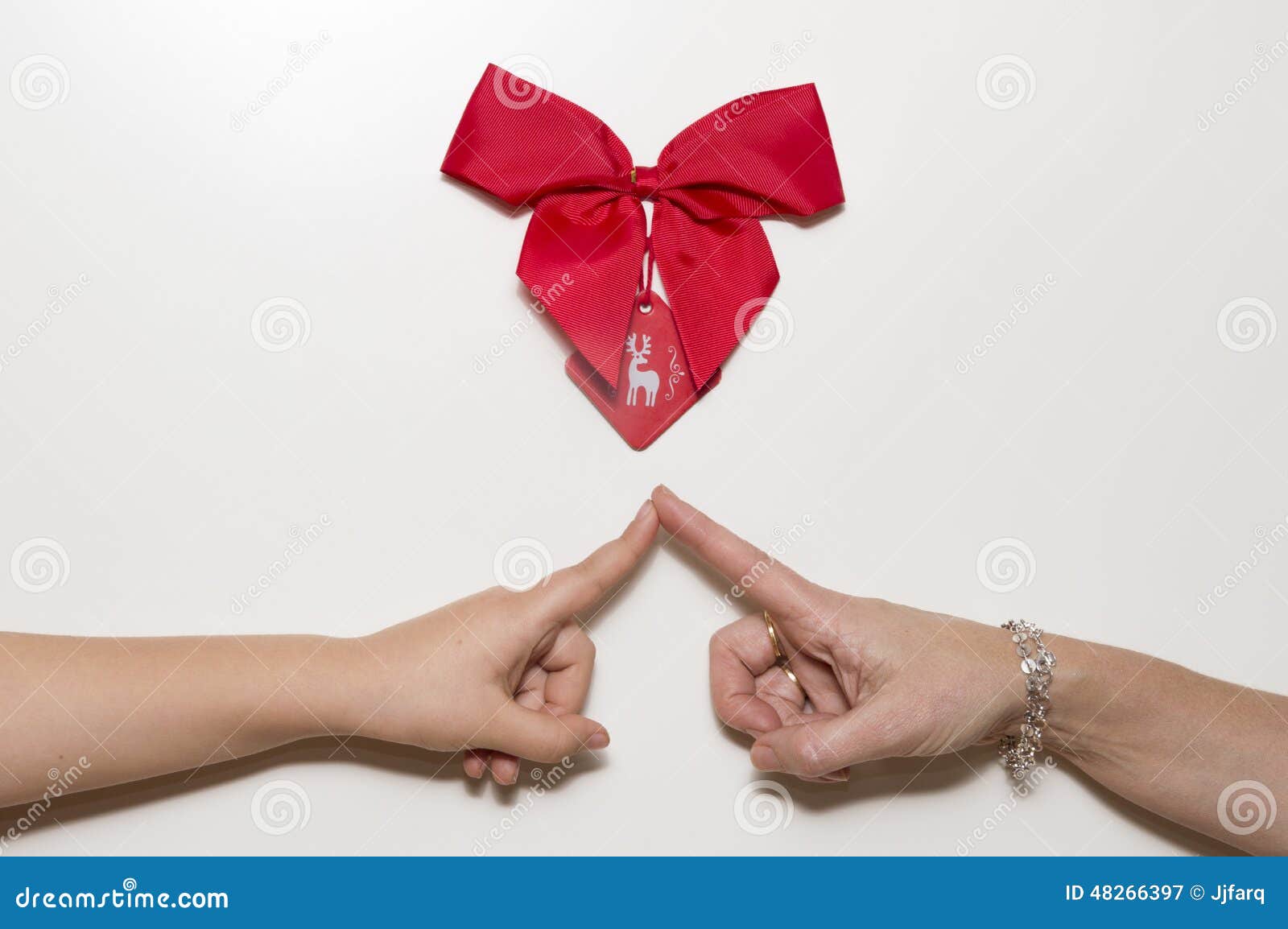 Two Hands with Fingers Touching Under a Red Ribbon Stock Image - Image ...