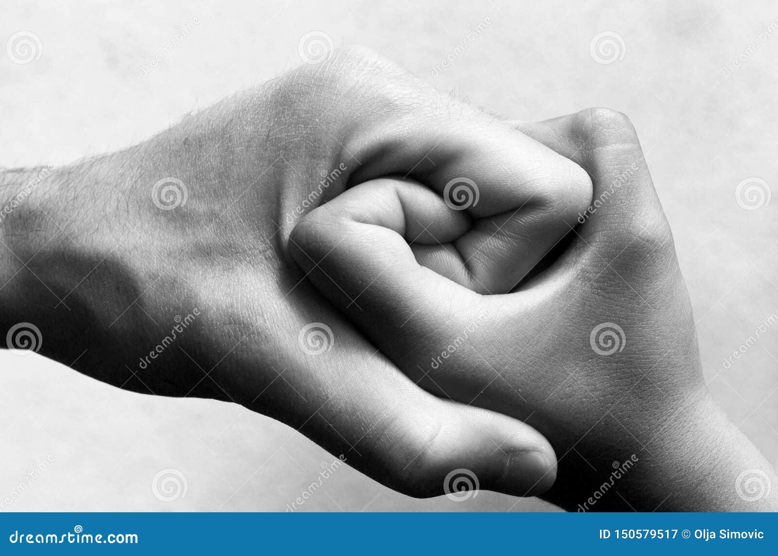 Two hands in the fist stock image. Image of hand, small - 150579517