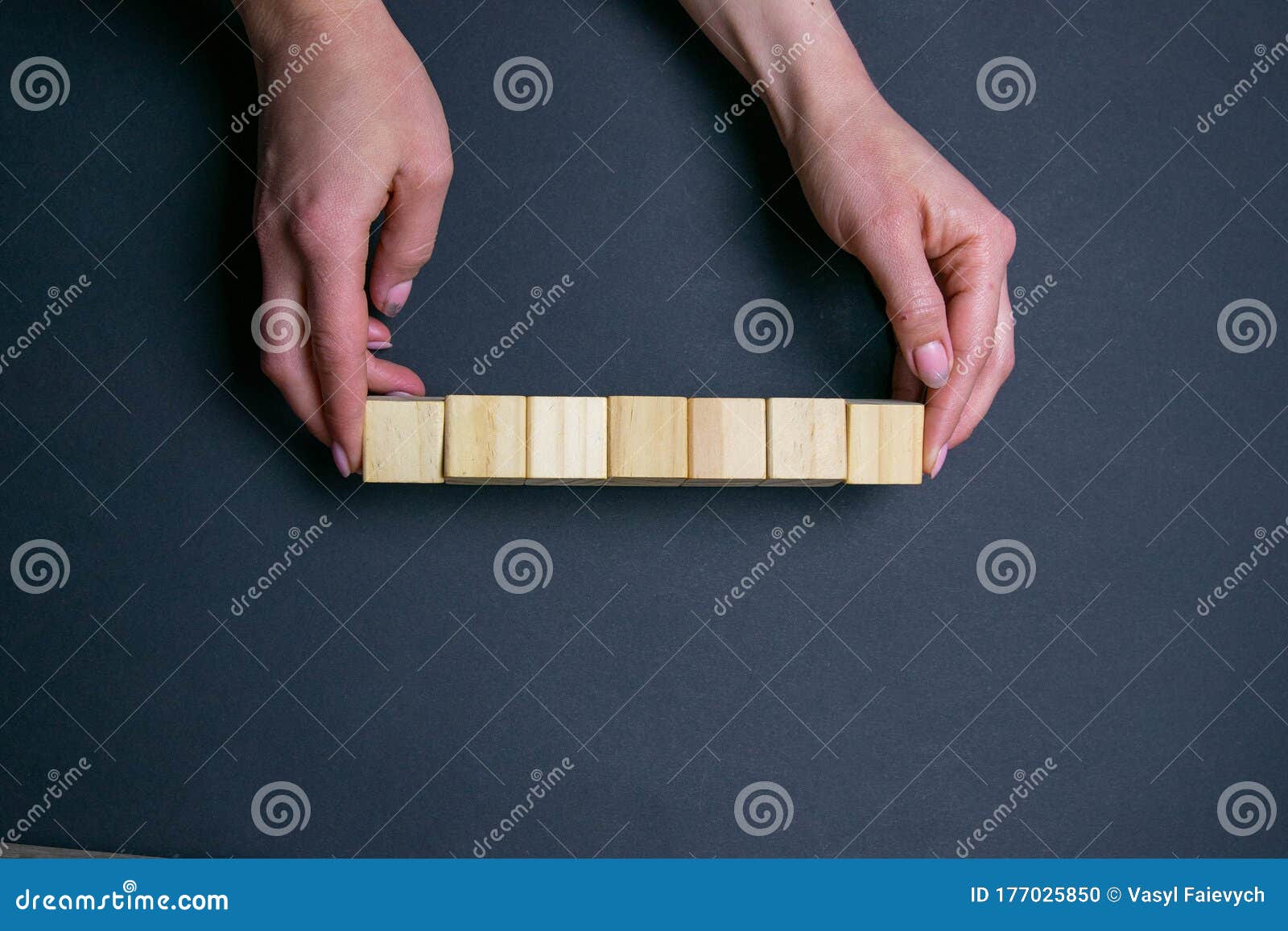 Two Hands Hold 7 Wooden Cubes, Provided Space for Text Stock Photo ...
