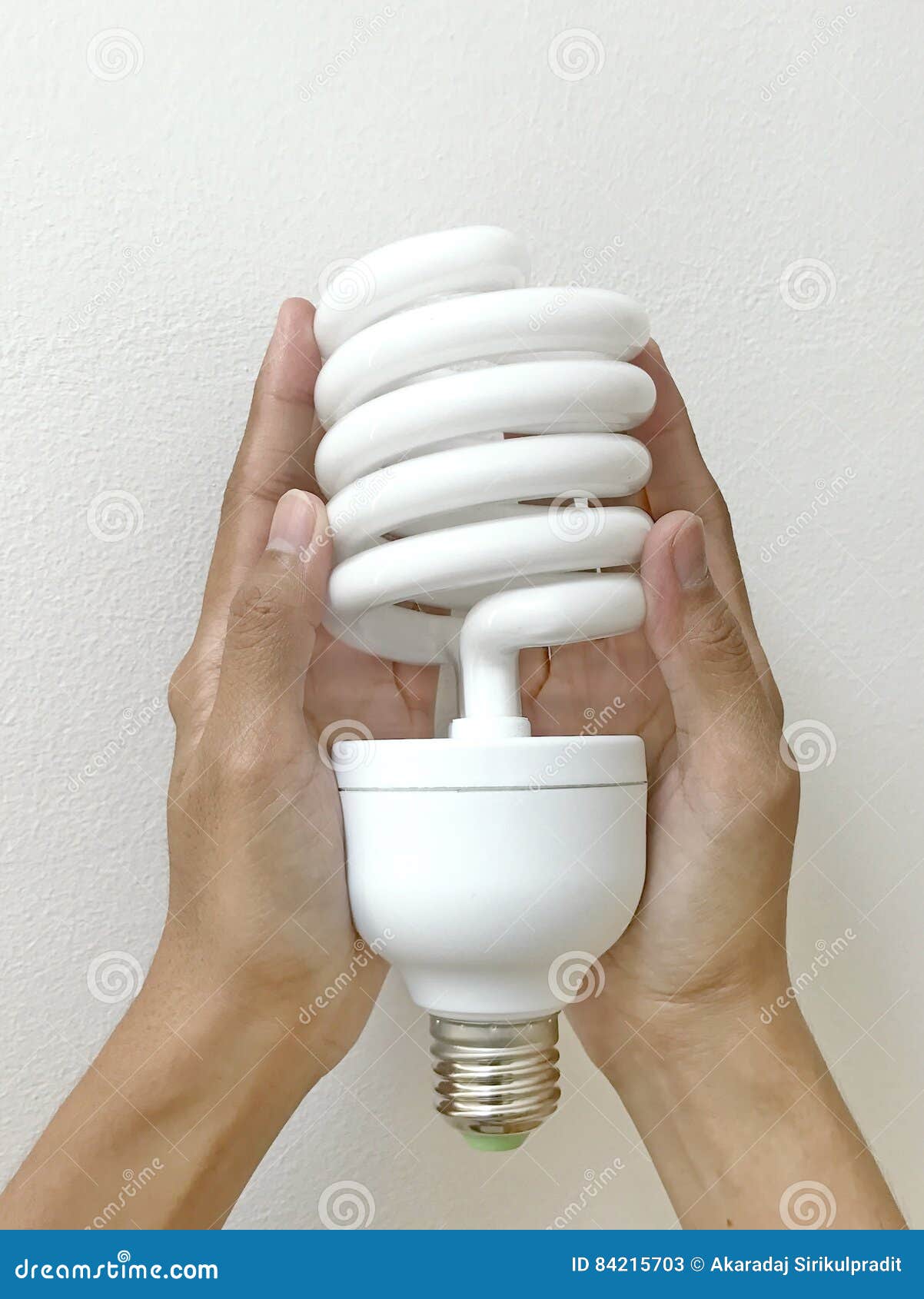 Two hands holding a lamp stock image. Image of life, innovation - 84215703
