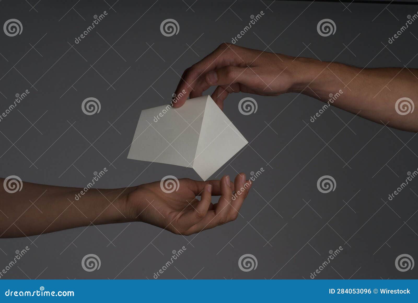 Two Hands with a Piece of Paper Stock Photo - Image of background ...