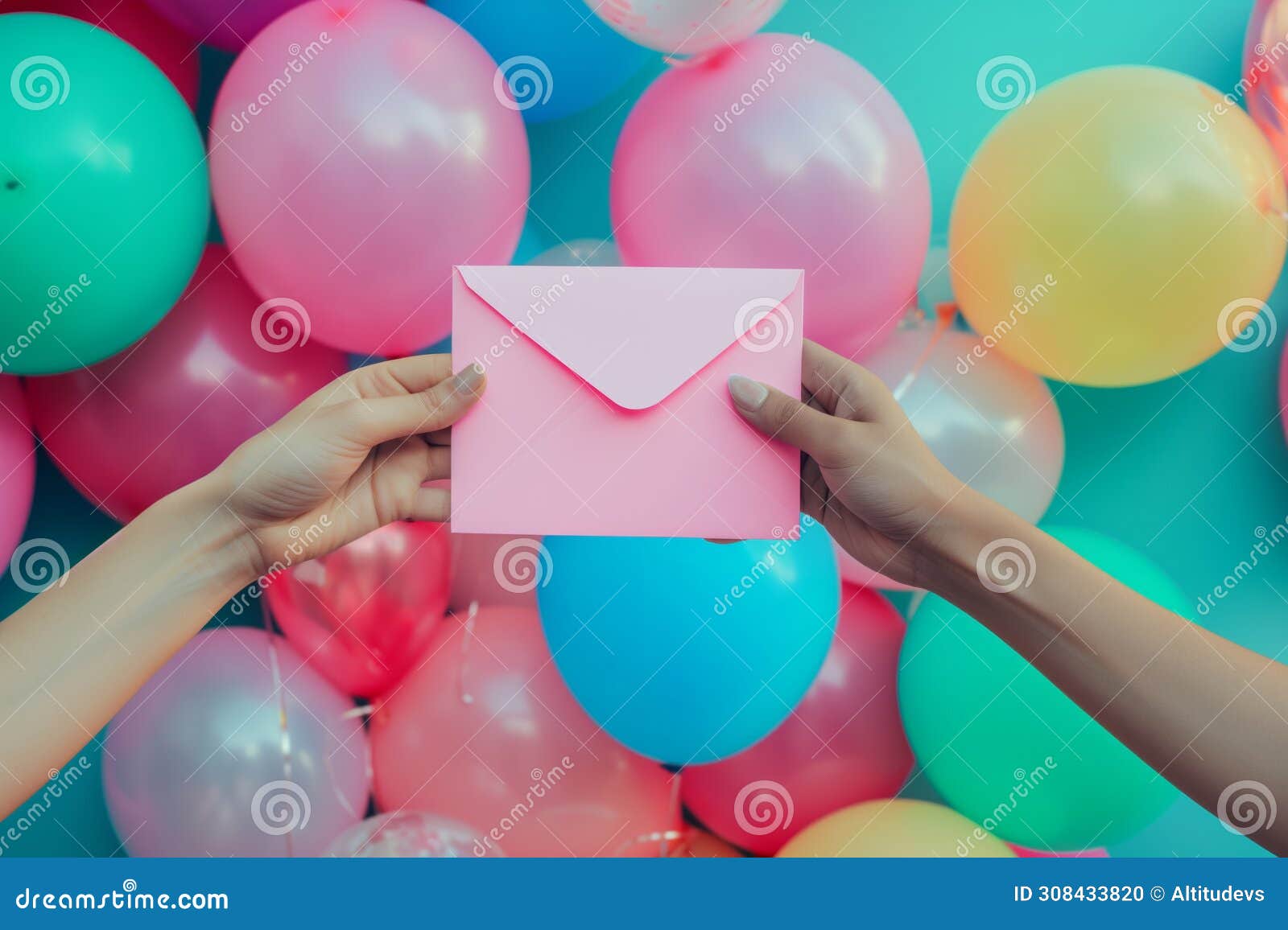 Two Hands Holding a Pink Envelope Against a Backdrop of Balloons Stock ...