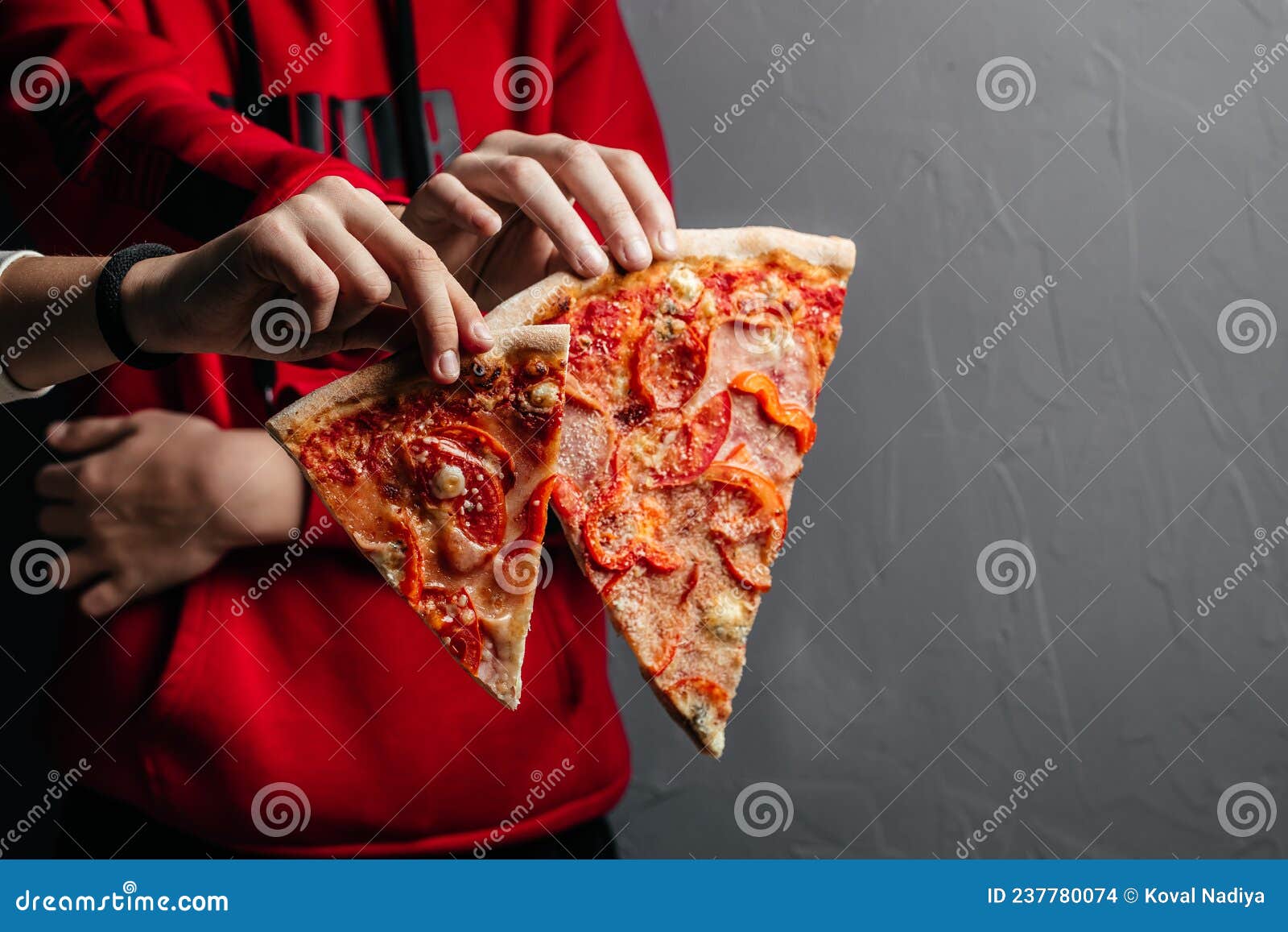Two Hands Holding Two Slices of Pizza. Delicious Pizza in Hand Stock ...