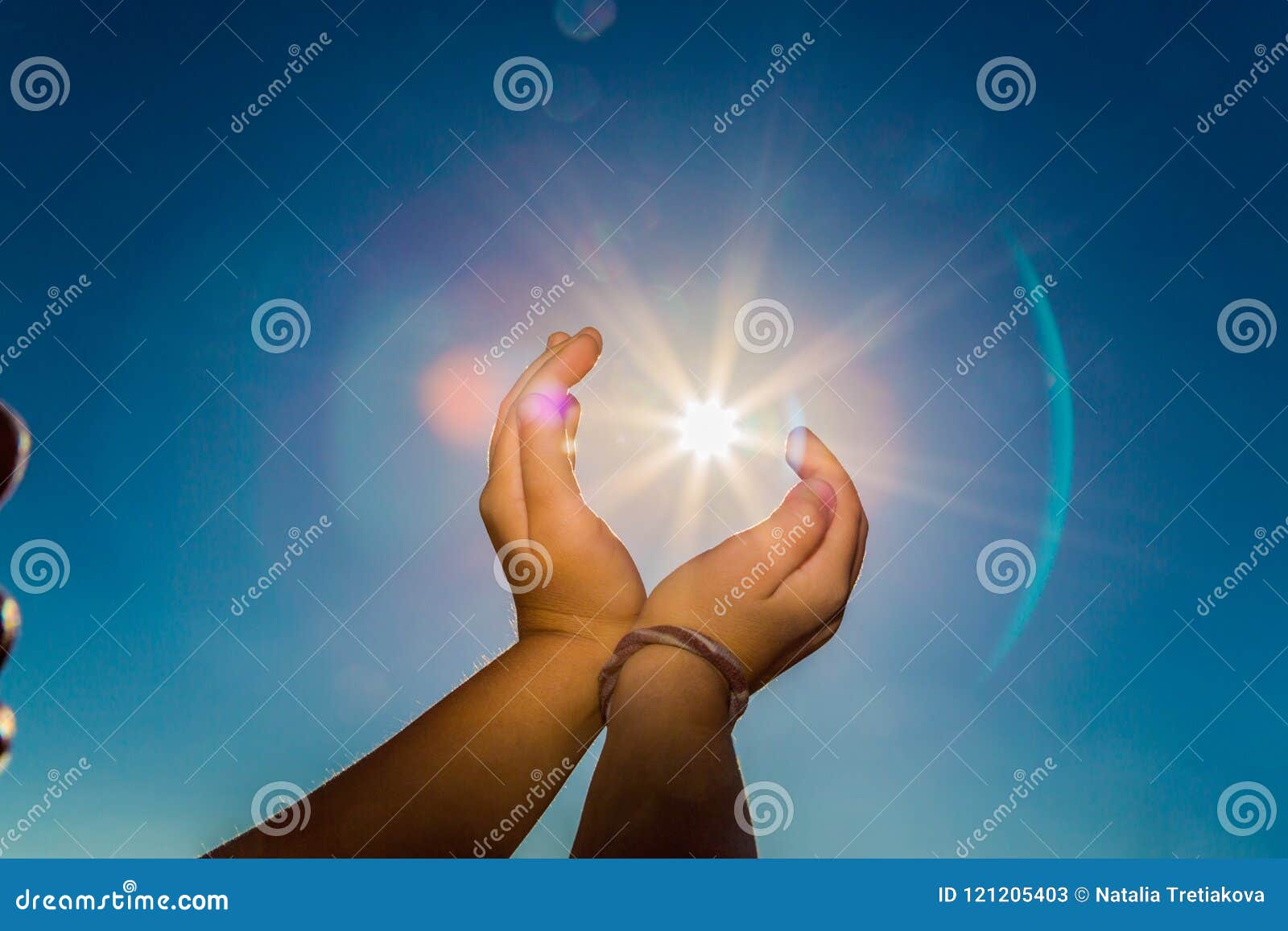 Two Hands Holding the Sun on a Blue Sky Background Stock Image - Image ...