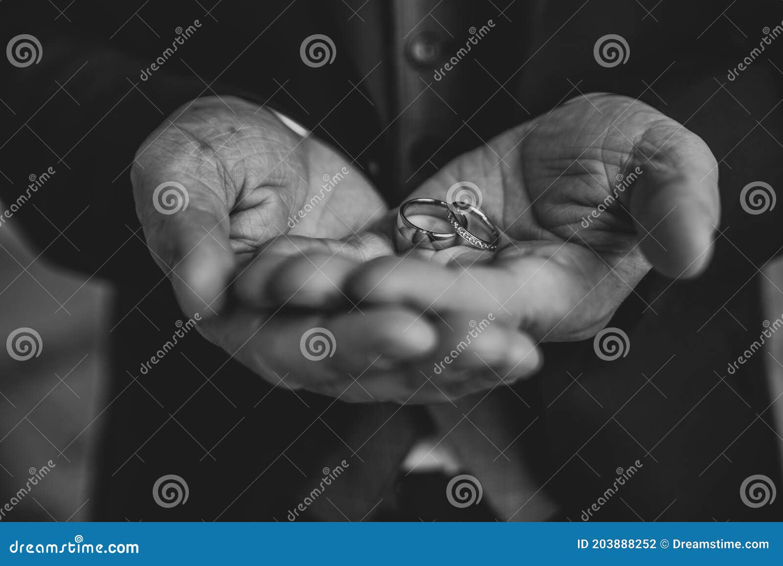 Holding Two Wedding Rings in Hands in Black and White. Stock Photo ...