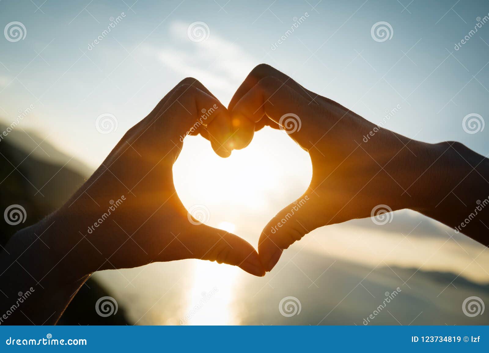 Two Hands Making A Heart Logo