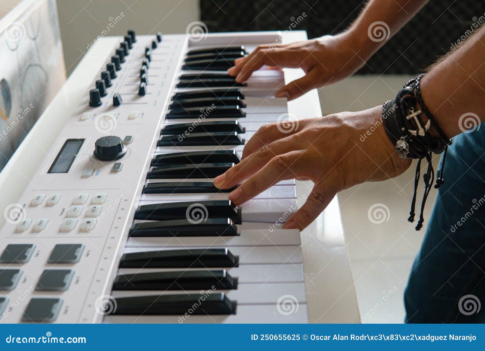 Two Hands of a Man Playing the Keyboard in a Studio. Stock Image ...