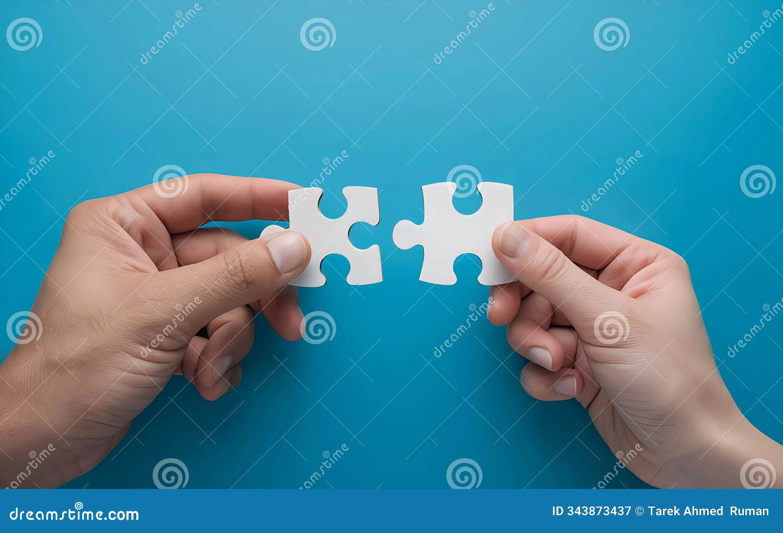 Two Hands, One on Each Side of the Frame, Hold Up Two White Puzzle ...