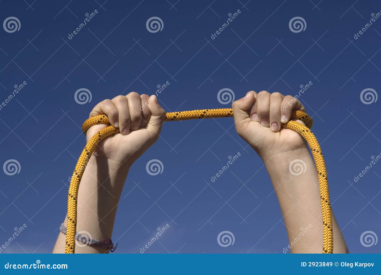 Two Hands With An Orange Rope Picture. Image: 2923849