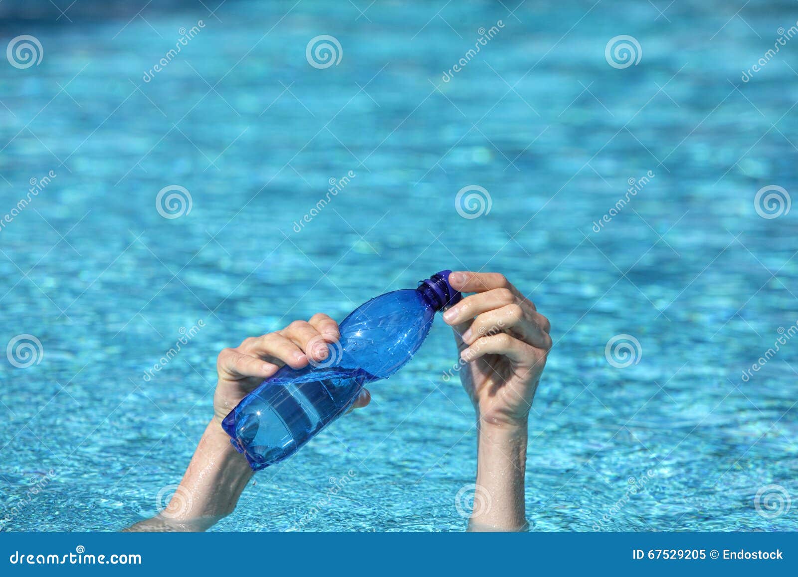Two Hands with Plastic Bottle of Water Above Surface of Water Stock ...