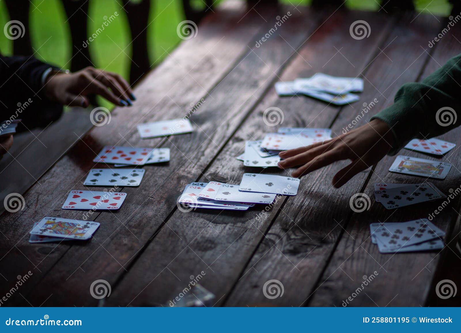 Two Hands Playing Cards on the Table Stock Image - Image of woman ...