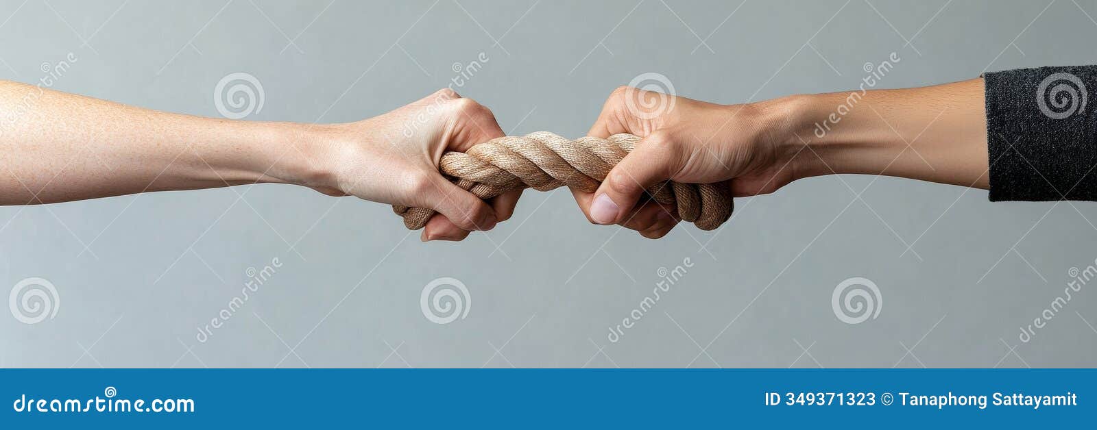 Two Hands Pulling A Rope In Opposite Directions, A Metaphor For The Tug ...