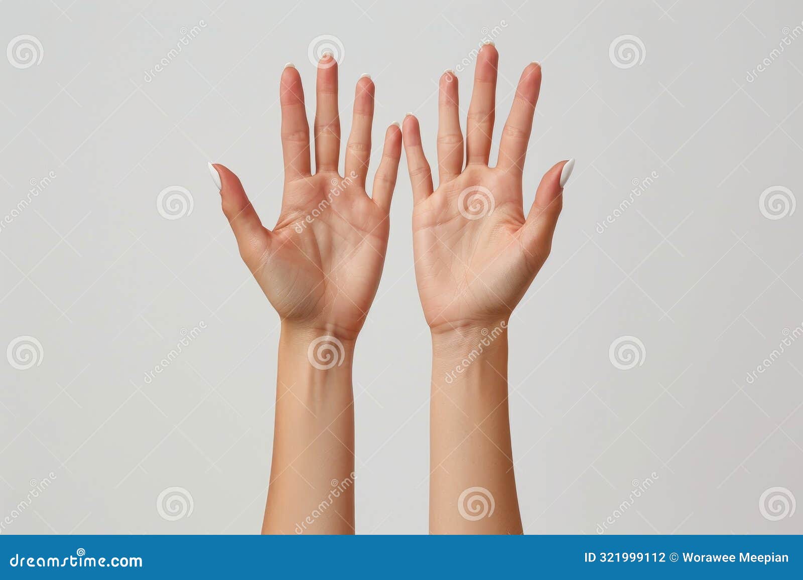 Two Hands are Raised in the Air, One of Which is Slightly Bent Stock ...