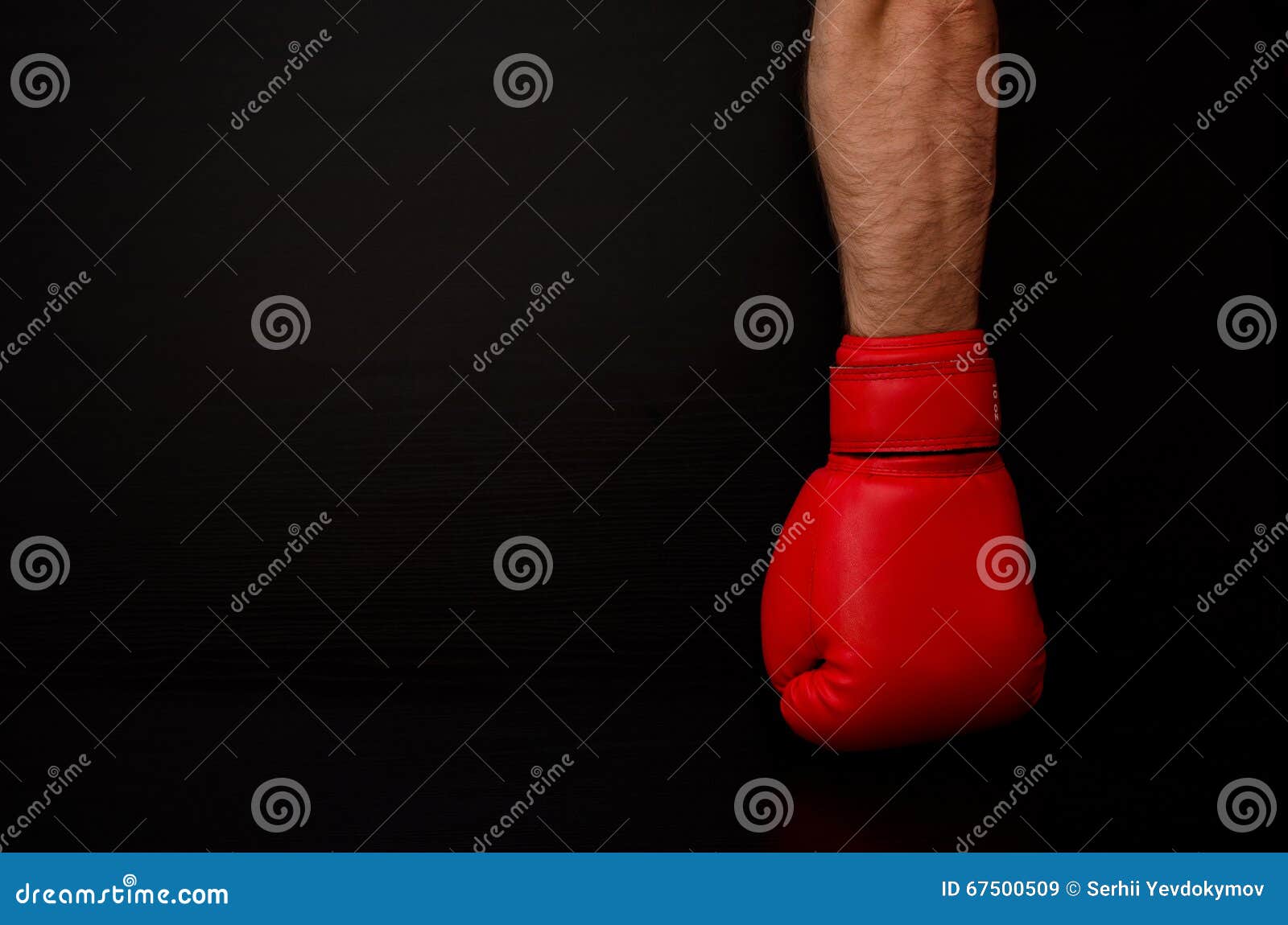 Two Hands in Red Boxing Gloves in the Side of the Frame on a Black ...
