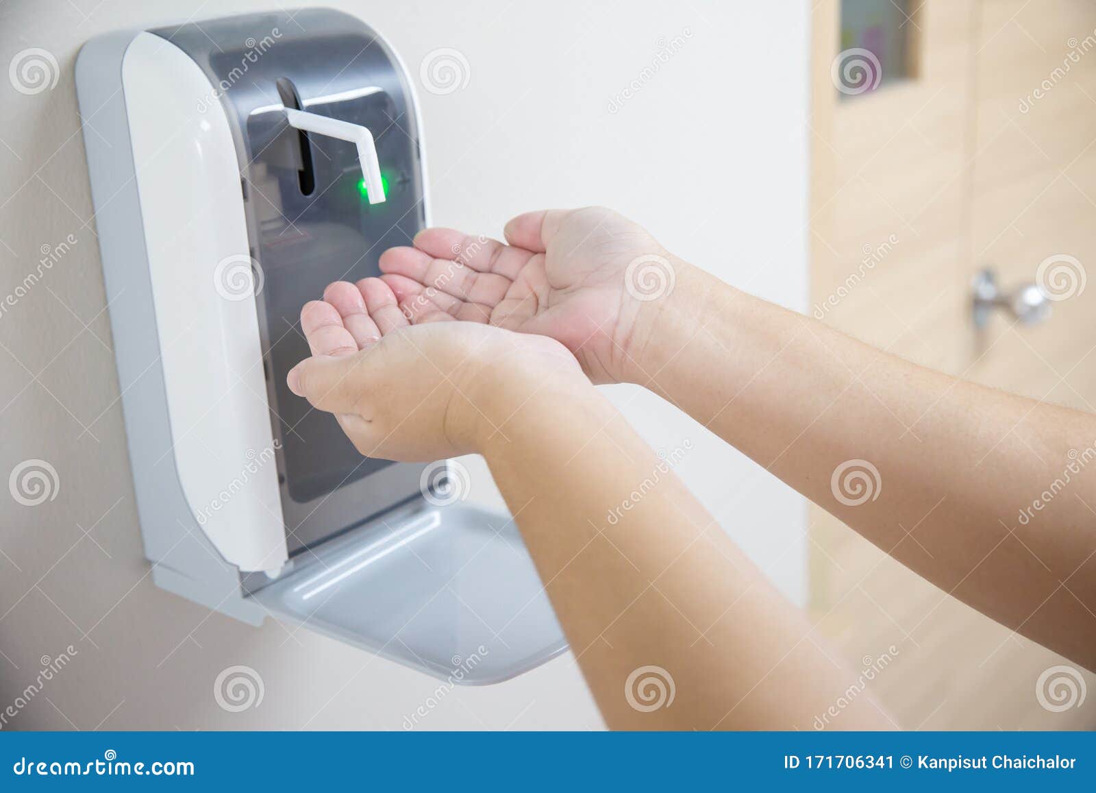 Two Hands Under the Automatic Alcohol Dispenser. Infection and ...