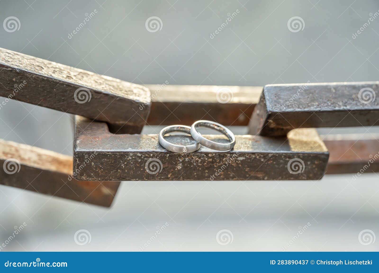 Two Hands with Wedding Rings Rest on a Strong Anchor Chain Stock Image ...