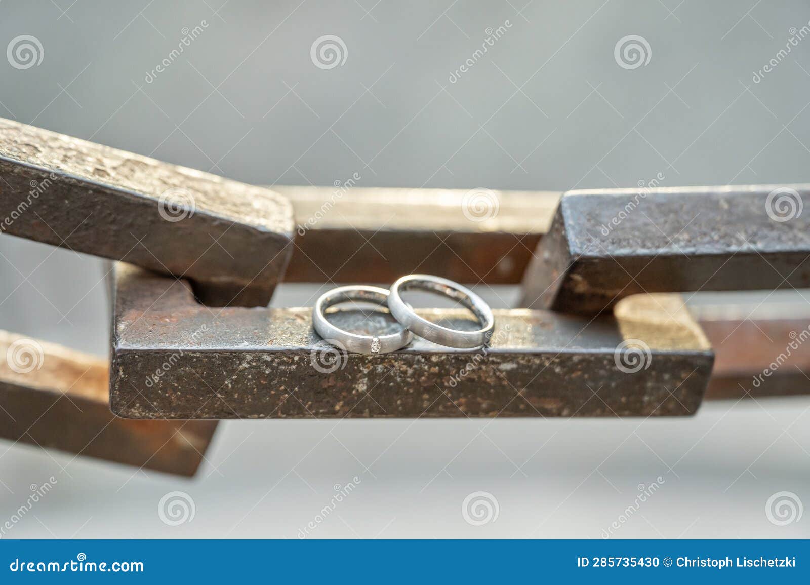 Two Hands with Wedding Rings Rest on a Strong Anchor Chain Stock Photo ...