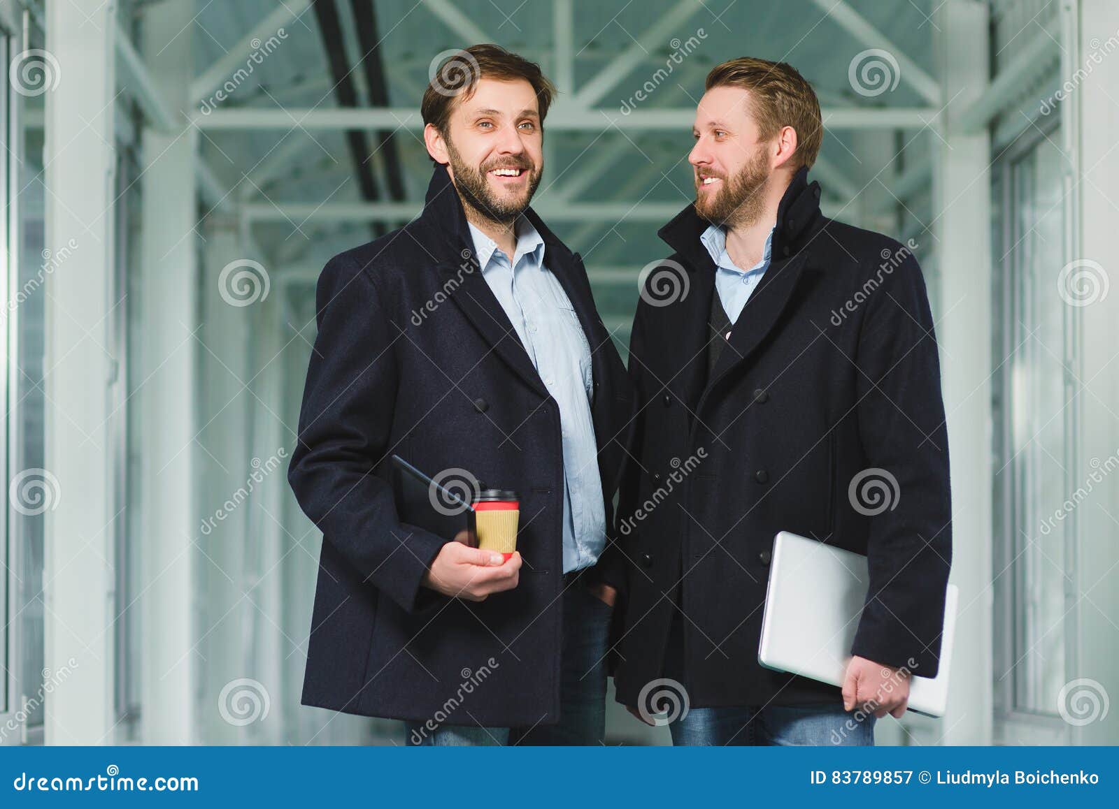 Two Handsome Businessmen Working Together on a Project at Lobby Stock ...