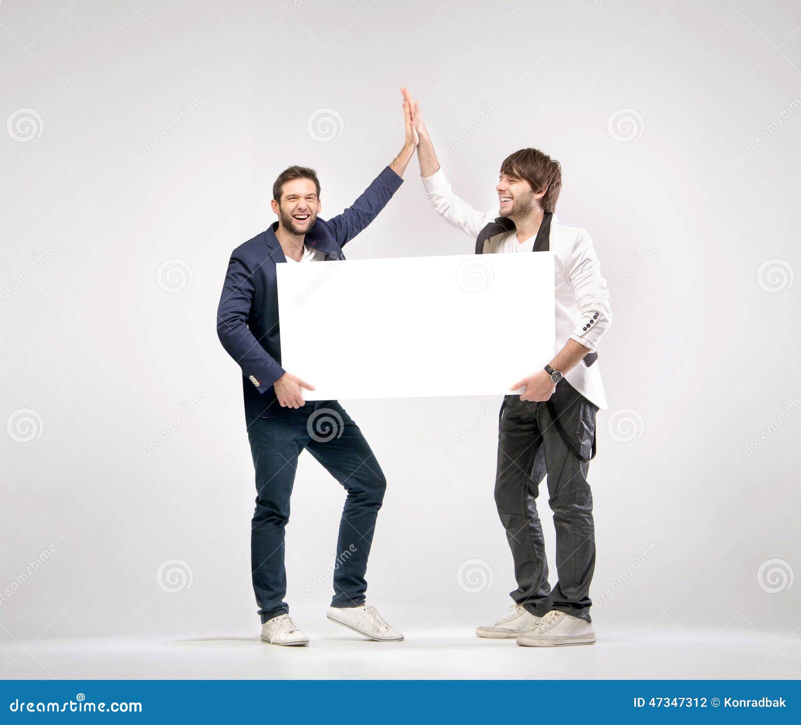 Two Handsome Friends Giving Each Other A High-five Stock Photo - Image ...