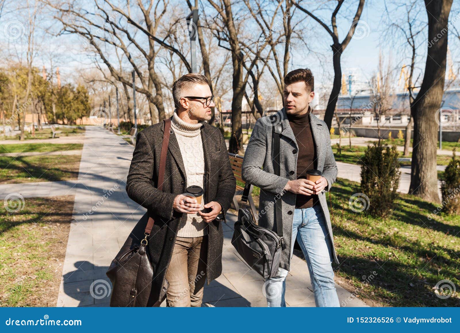 Two Handsome Men Wearing Coats Spending Time Stock Photo - Image of ...