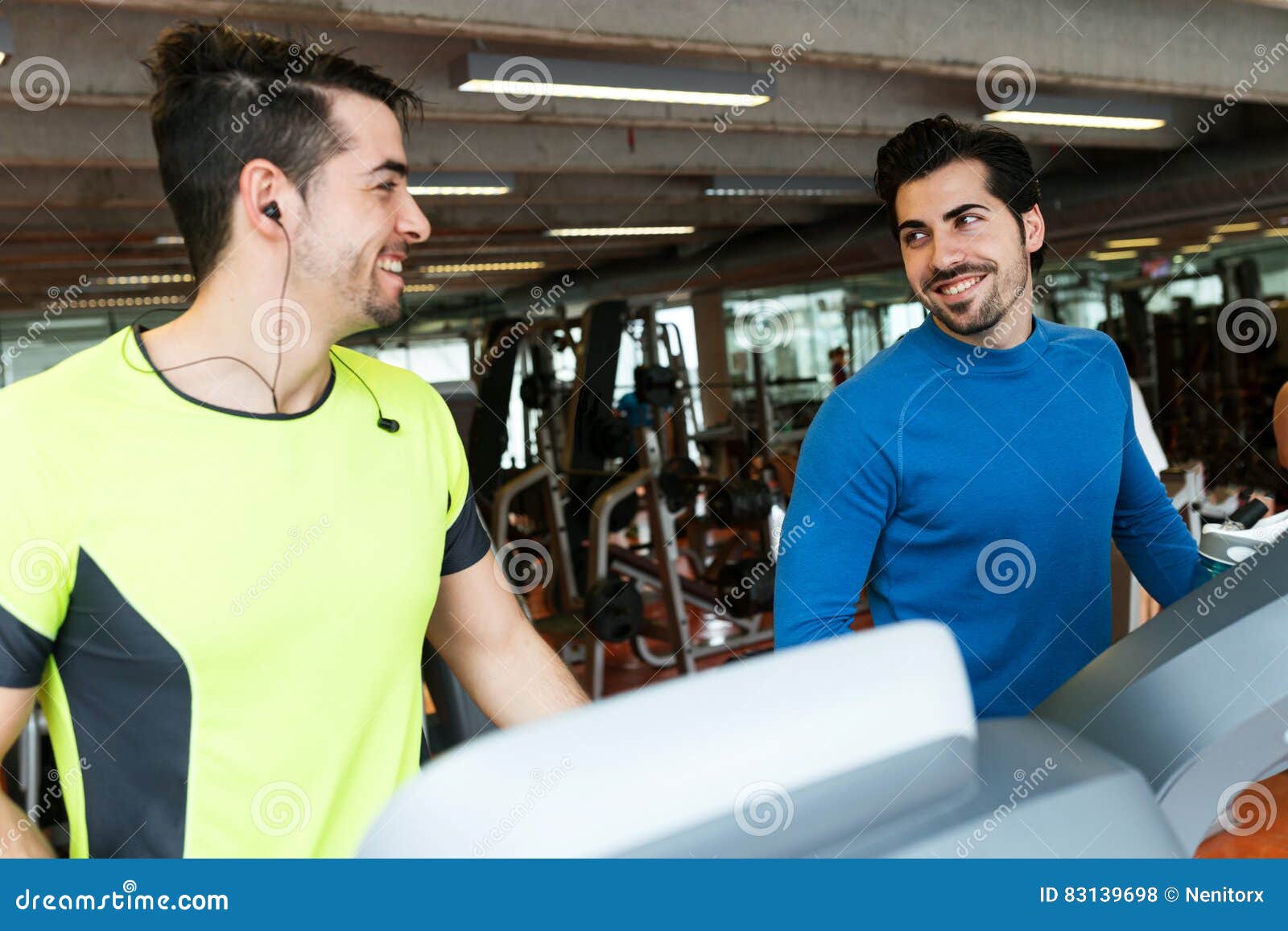Two Handsome Young Men Doing Cardio Training in Gym. Stock Photo ...