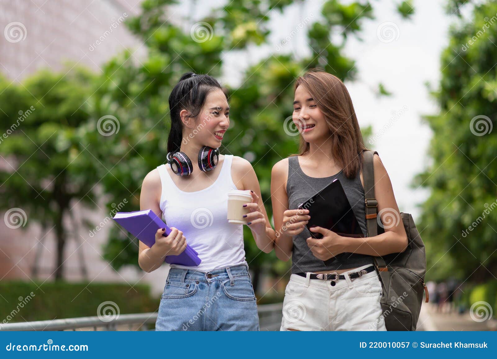 Two Happy Asian Students Talking while Walking in Campus Stock Image ...