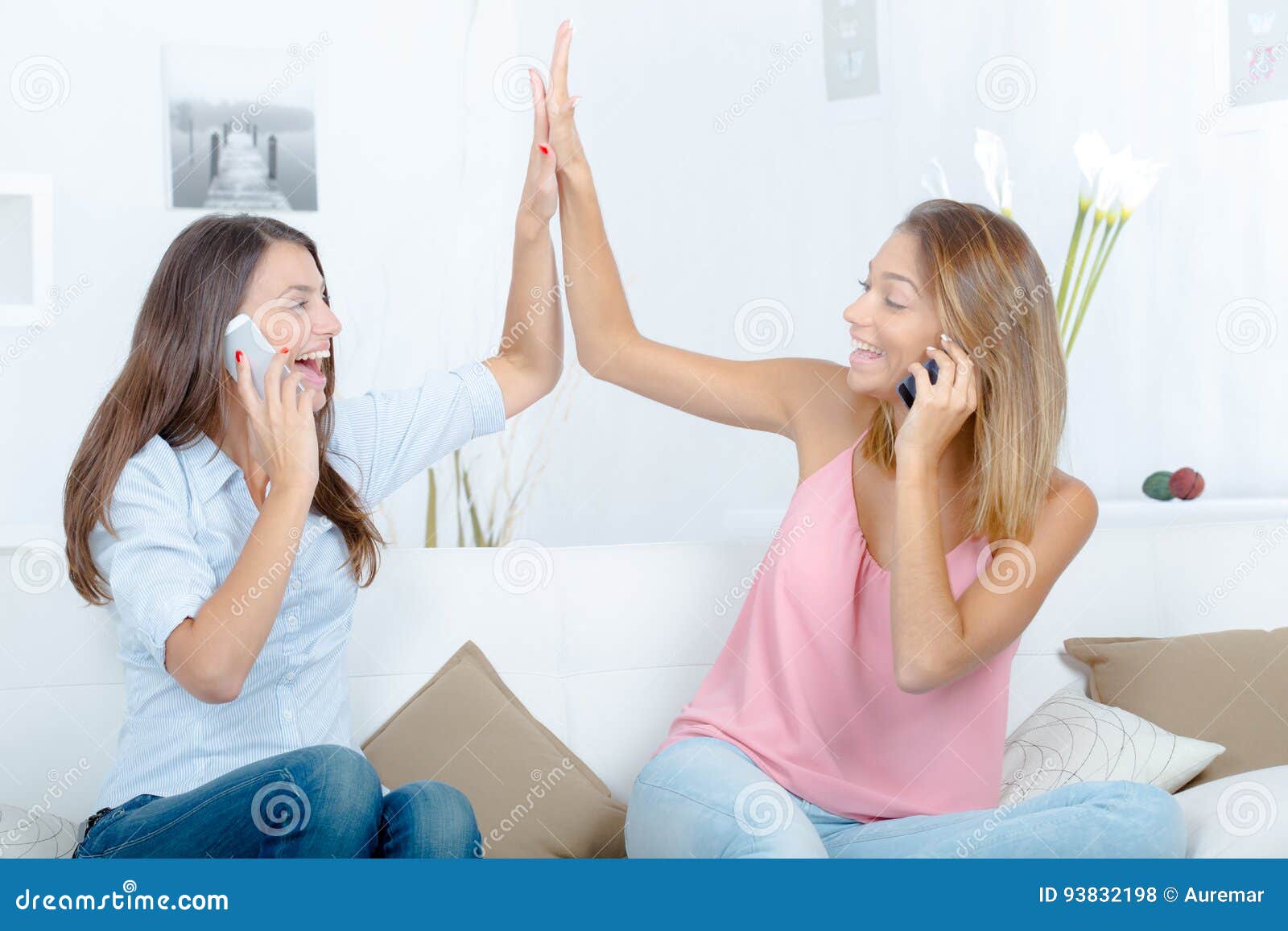 Two Happy Beautiful Women Do High Five on Sofa Stock Photo - Image of ...