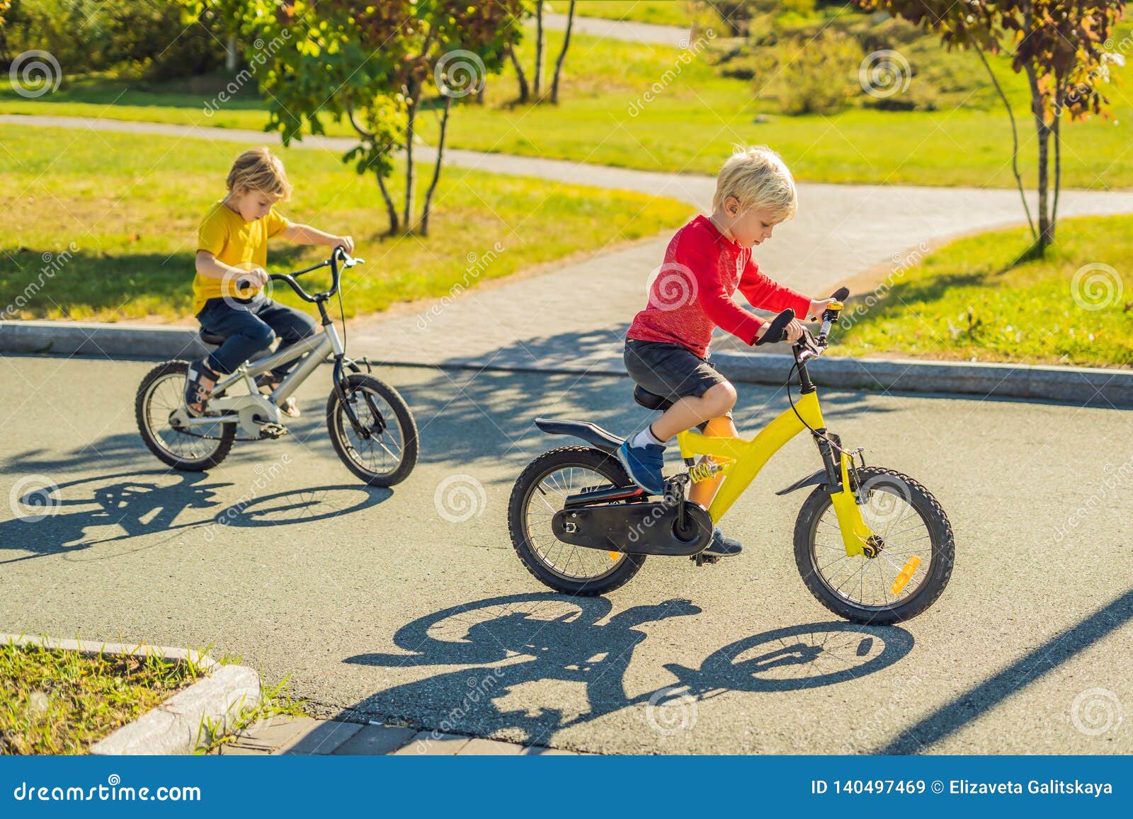 Two Happy Boys Cycling in the Park Stock Image - Image of cyclist ...