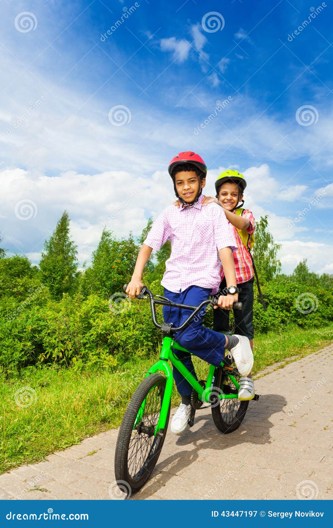 Two Happy Boys Riding Same Bike Both Standing Stock Image - Image of ...