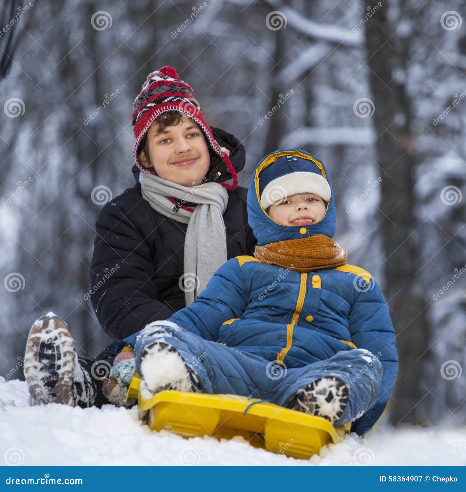 Two happy boys on sled stock image. Image of outdoors - 58364907