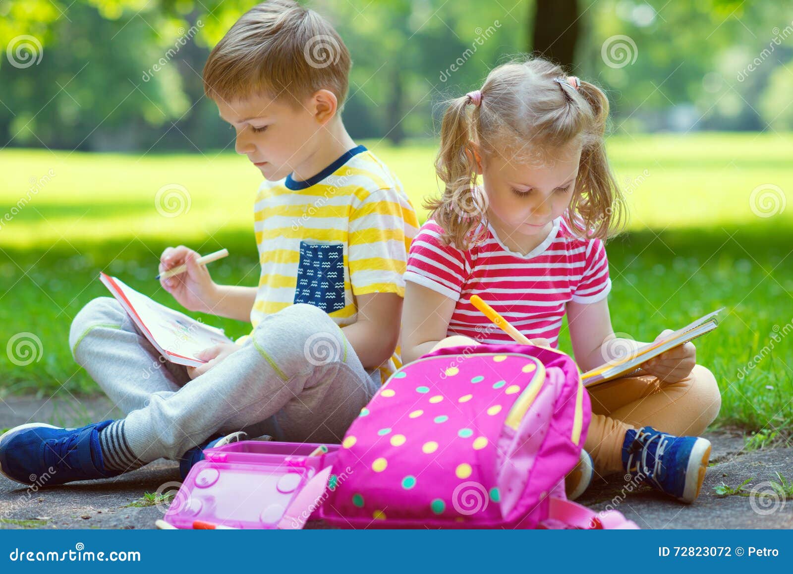 Two happy children in park stock photo. Image of education - 72823072