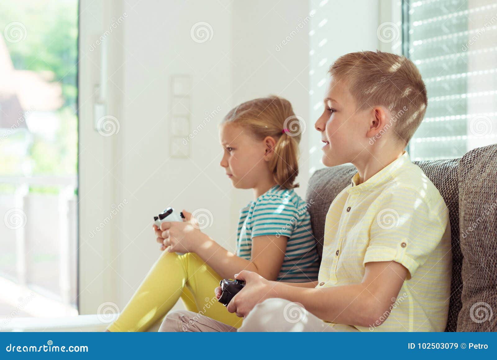 Two Happy Children Playing Video Games at Home Stock Image - Image of ... Two Happy Children Playing Video Games at Home Stock Image - Image of ...