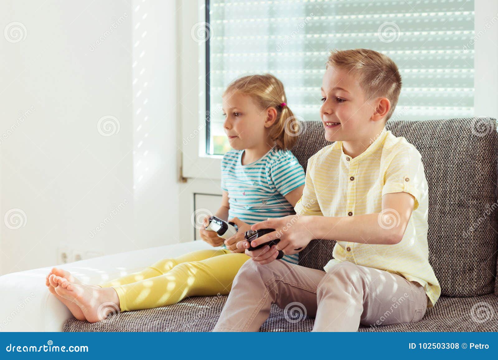 Two Happy Children Playing Video Games at Home Stock Photo - Image of ... Two Happy Children Playing Video Games at Home Stock Photo - Image of ...