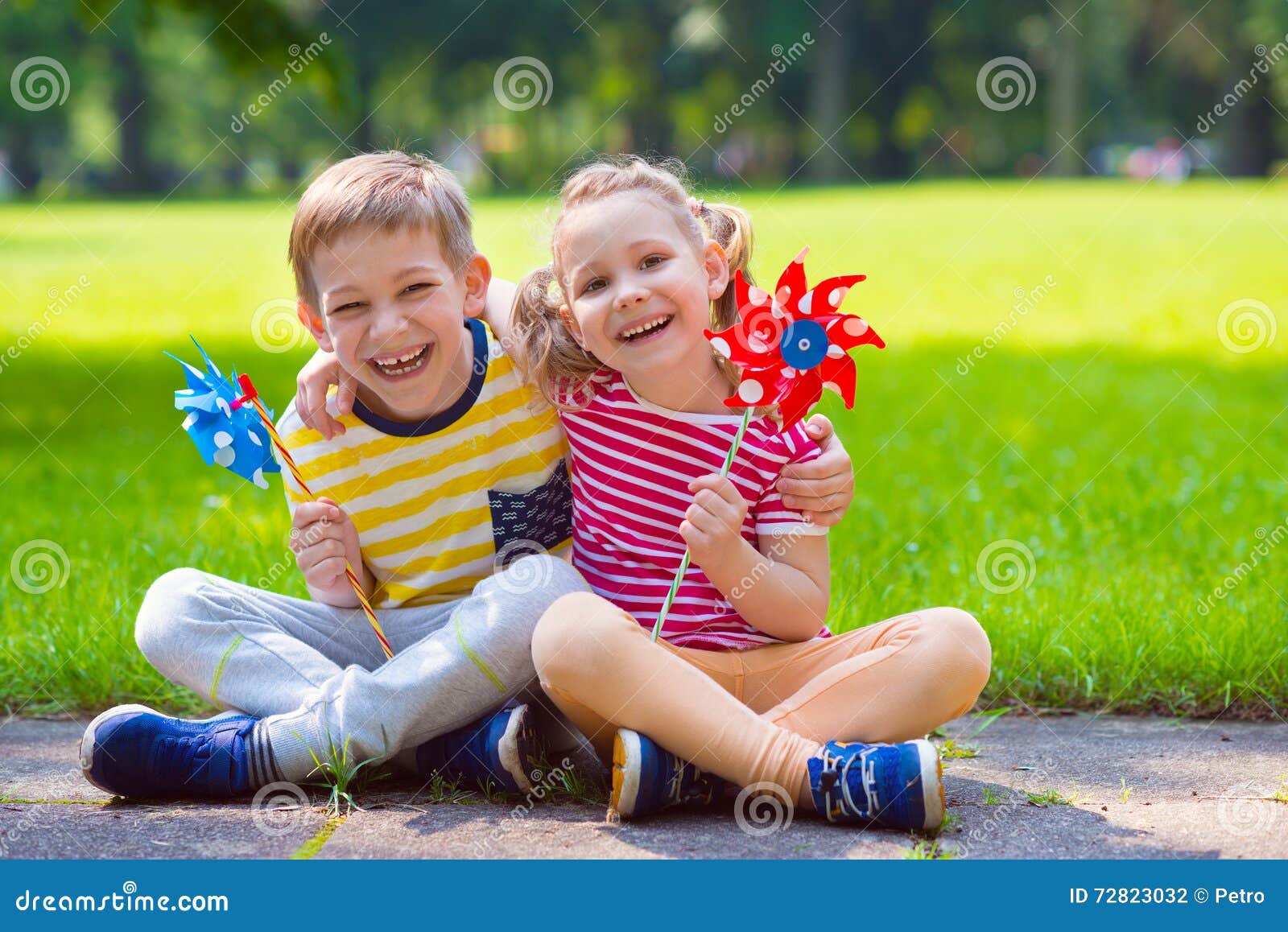 Two Happy Children Playing with Windmill Stock Photo - Image of ...