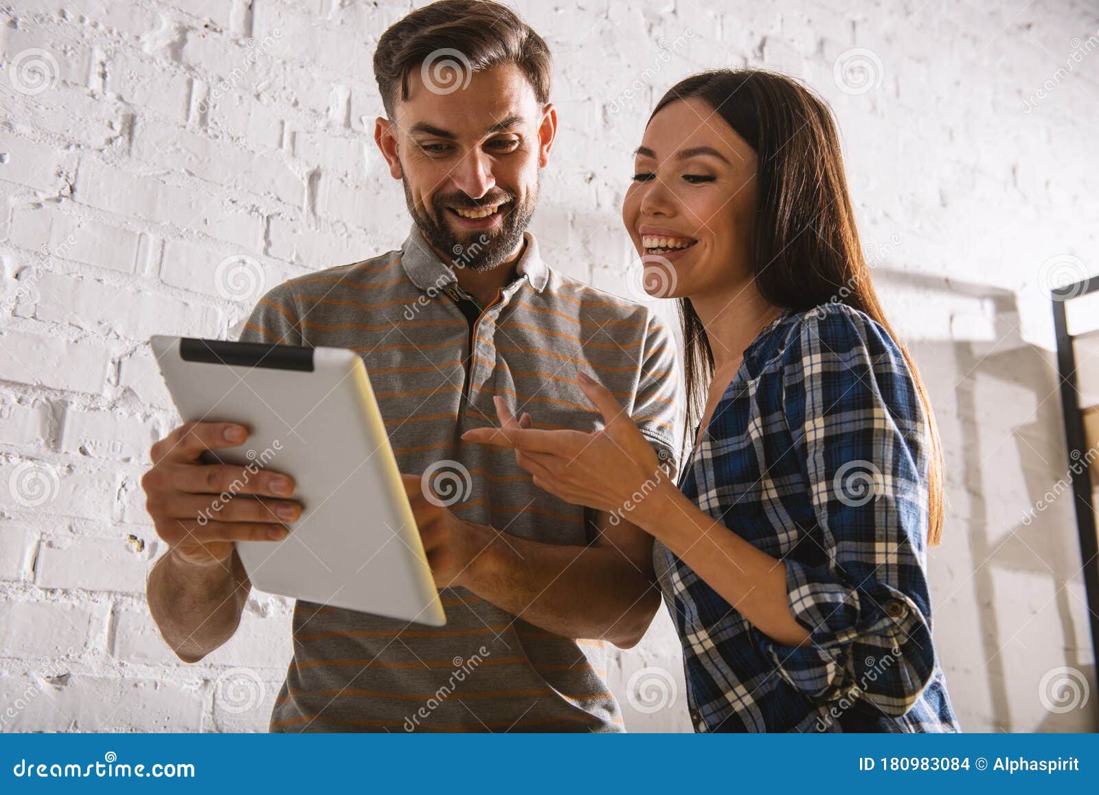 Two Happy Colleagues Work with a Tablet in Office Stock Photo - Image ... Two Happy Colleagues Work with a Tablet in Office Stock Photo - Image ...
