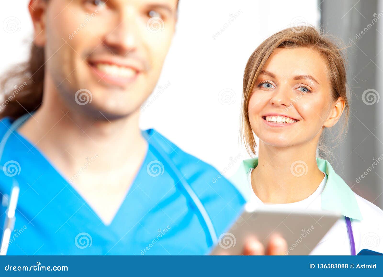 Two happy doctors stock photo. Image of attractive, health - 136583088